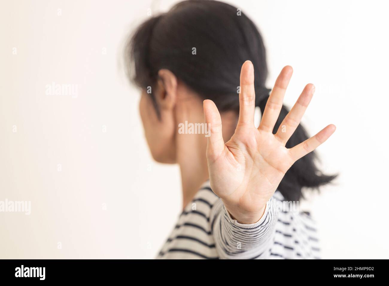 Hand gesture Stop, No. Woman rises her hand up, covering her face and ...