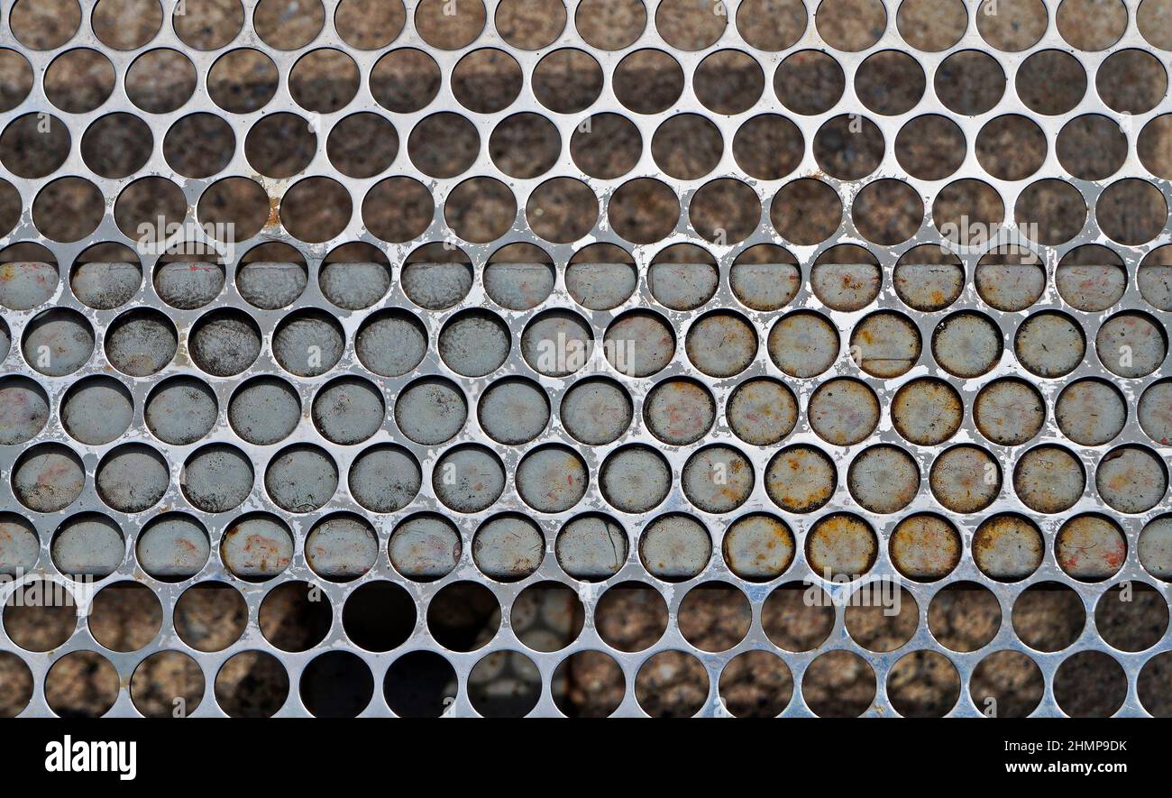 Perforated metallic surface texture background Stock Photo - Alamy