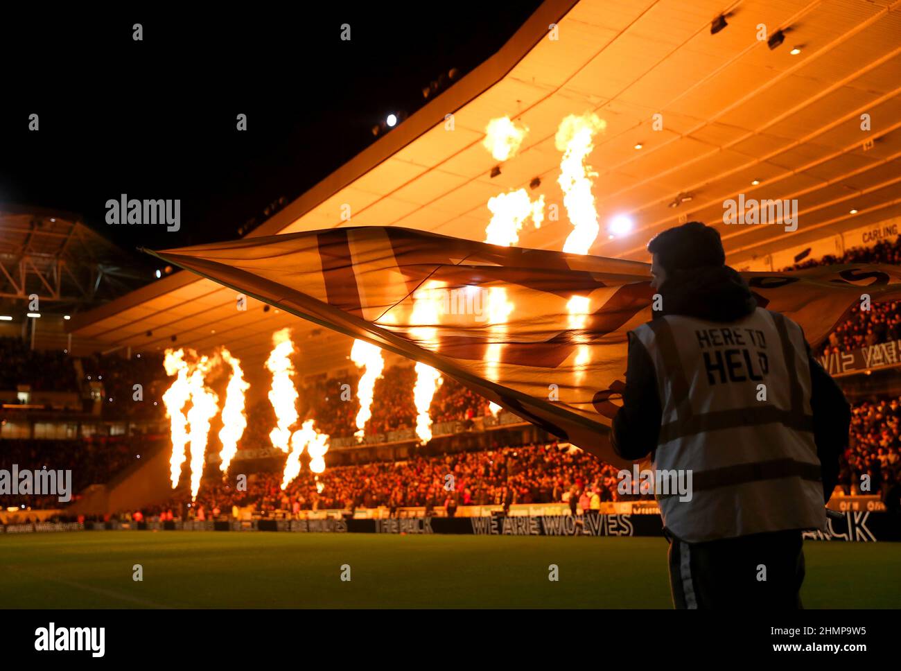 A Wolverhampton Wanderers flag is waved on the pitch ahead of the ...