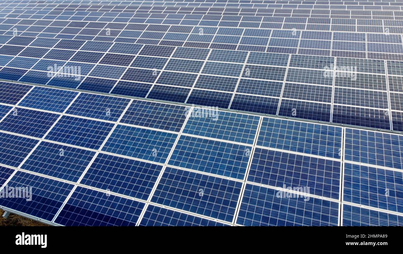 Aerial drone view flight over solar panels on sunny day close-up ...