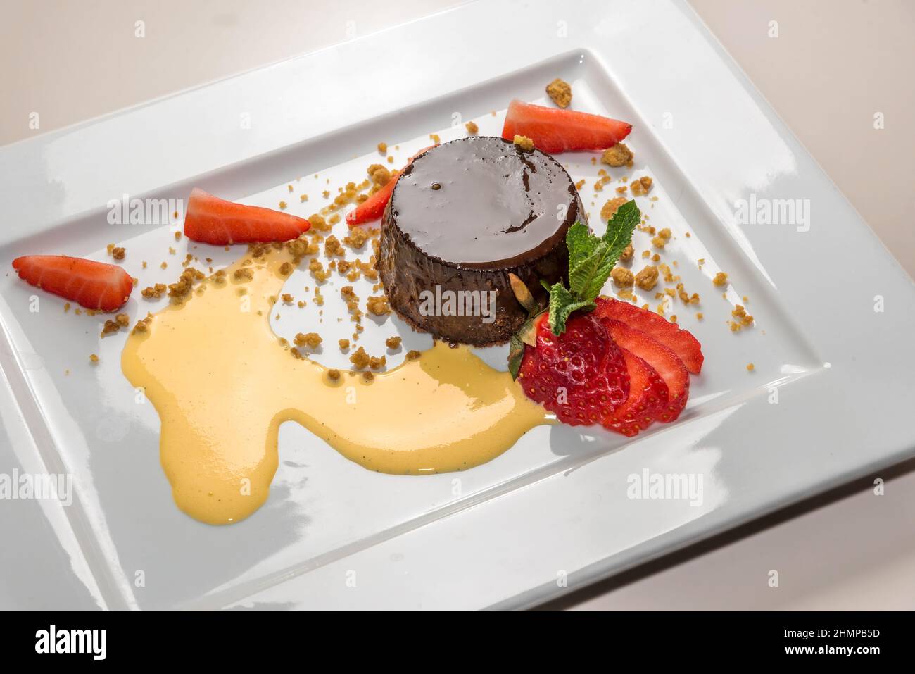 Bunet pudding,traditional italian Piedmont dessert in white plate with ...