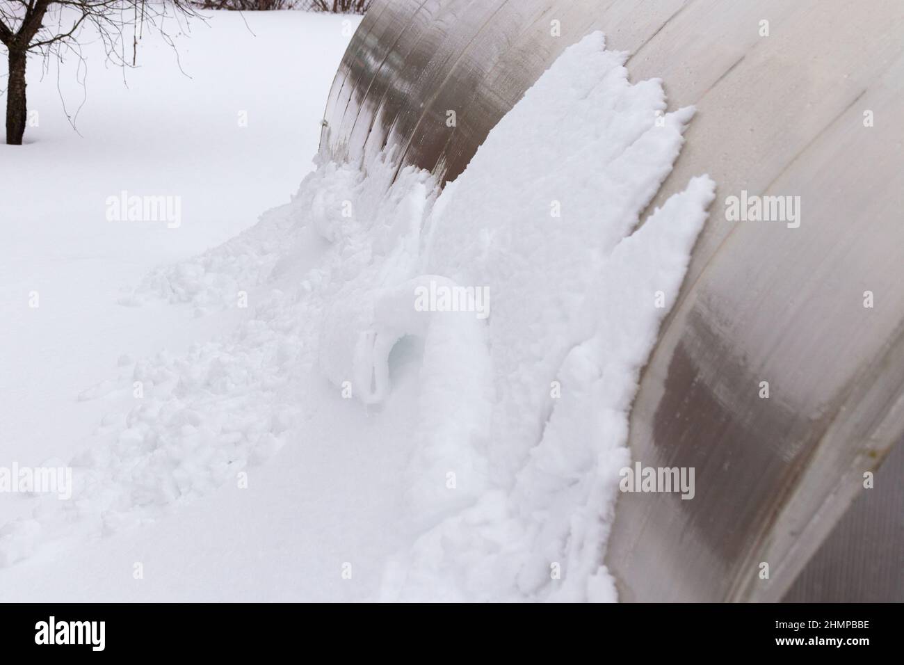 greenhouse covered with white snow and ice in winter, farming snow ...
