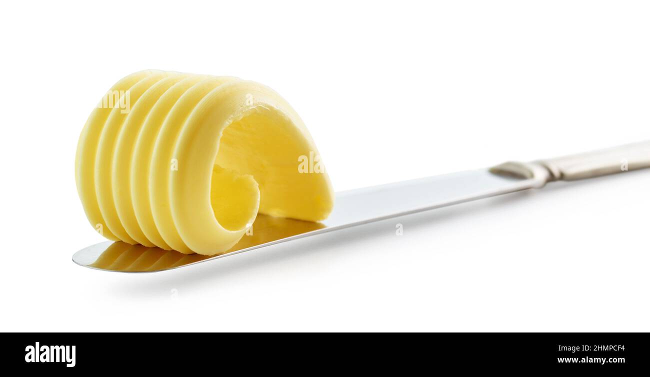 curl of fresh butter on a knife isolated on white background Stock ...
