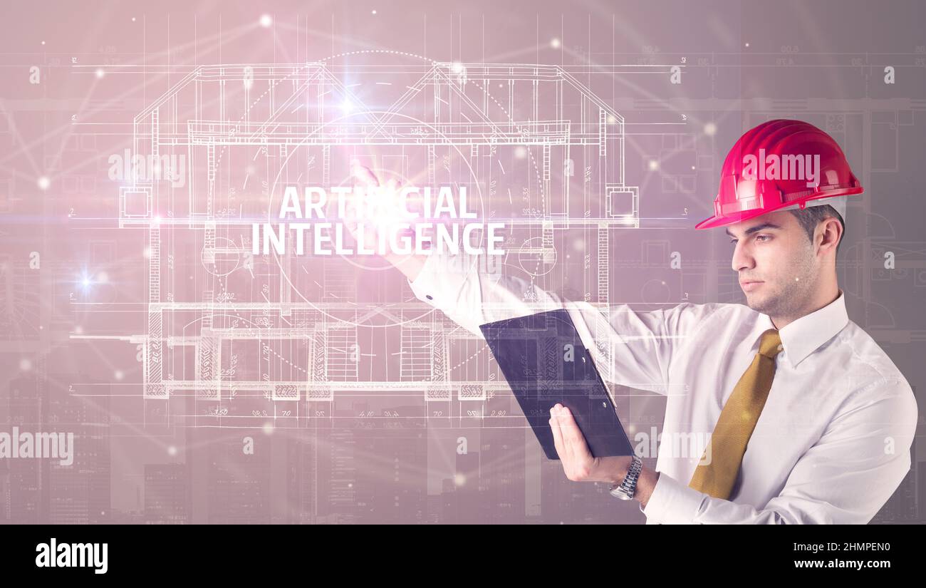 Handsome architect drawing with helmet Stock Photo - Alamy