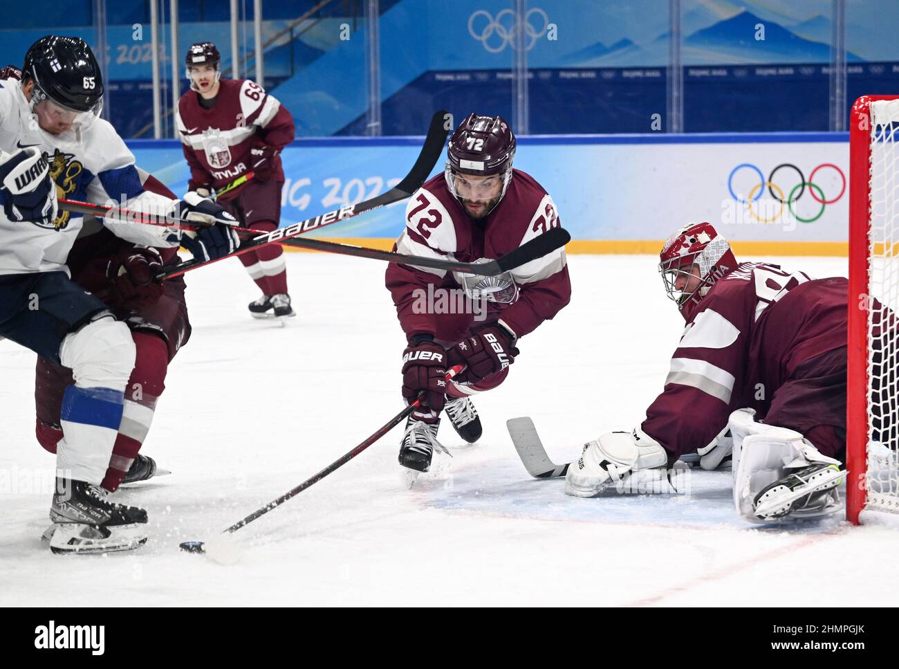 Beijing, China. 11th Feb, 2022. Janis Jaks (2nd R) of Latvia competes ...