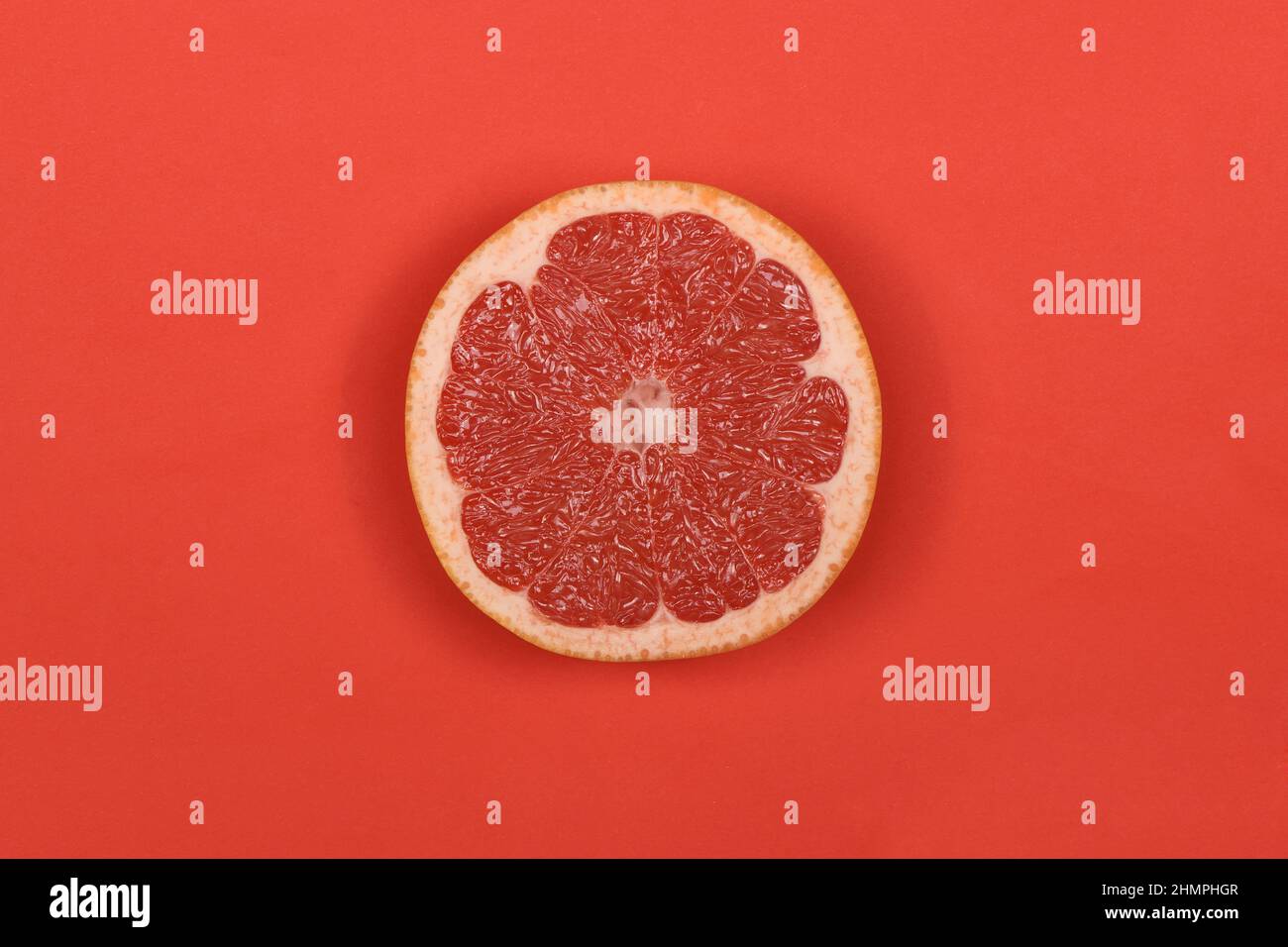Grapefruit isolated on red background. High resolution photo. Full ...