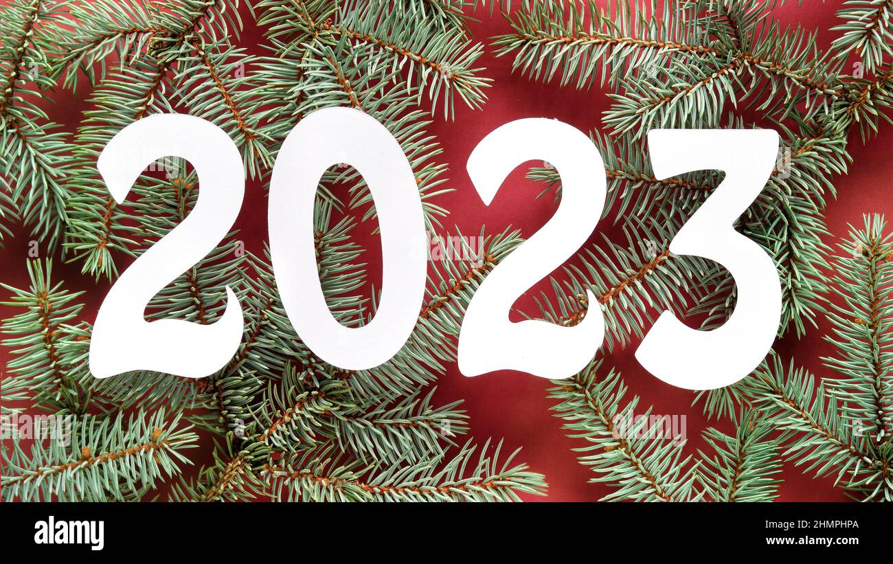 Outline of 2023 paper numbers on red background. Flat lay, top view ...