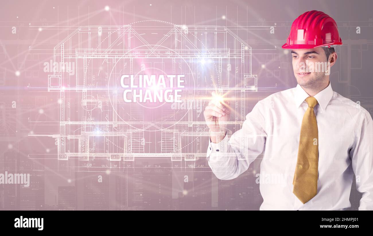 Handsome architect drawing with helmet Stock Photo - Alamy