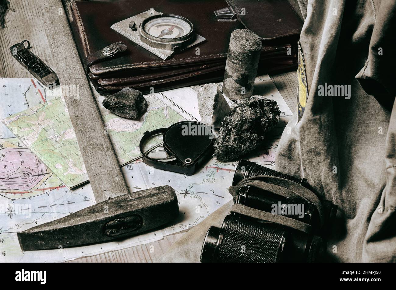 Geological fieldwork tools:map case, geological hammer, compass ...