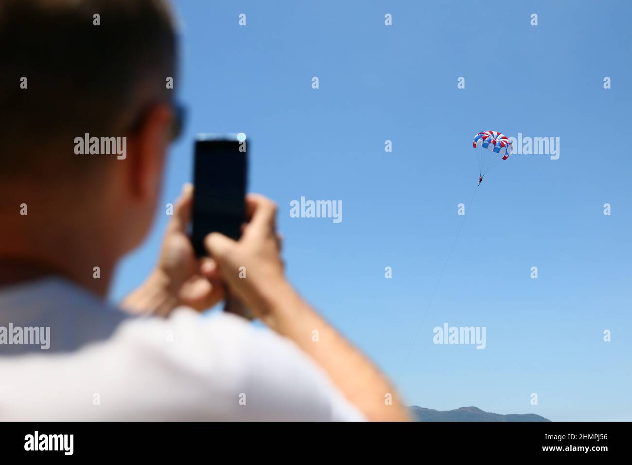 Parachute helmet with an installed DSLR camera in the hands of a ...