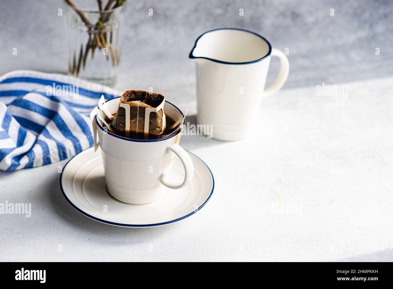 An individual cup of coffee brewing Stock Photo - Alamy