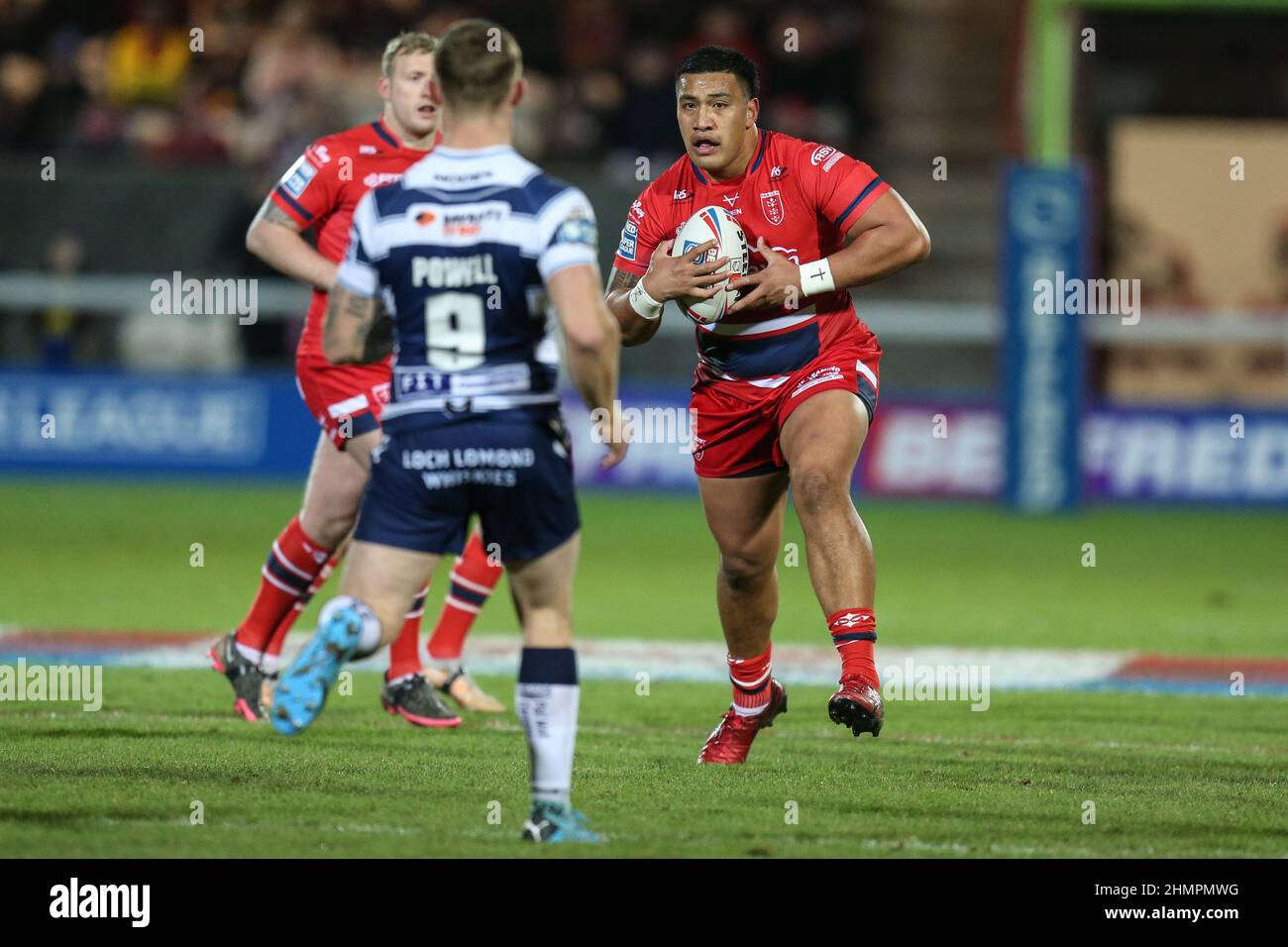 Albert Vete #8 of Hull KR runs at Sam Powell #9 of Wigan Warriors Stock ...