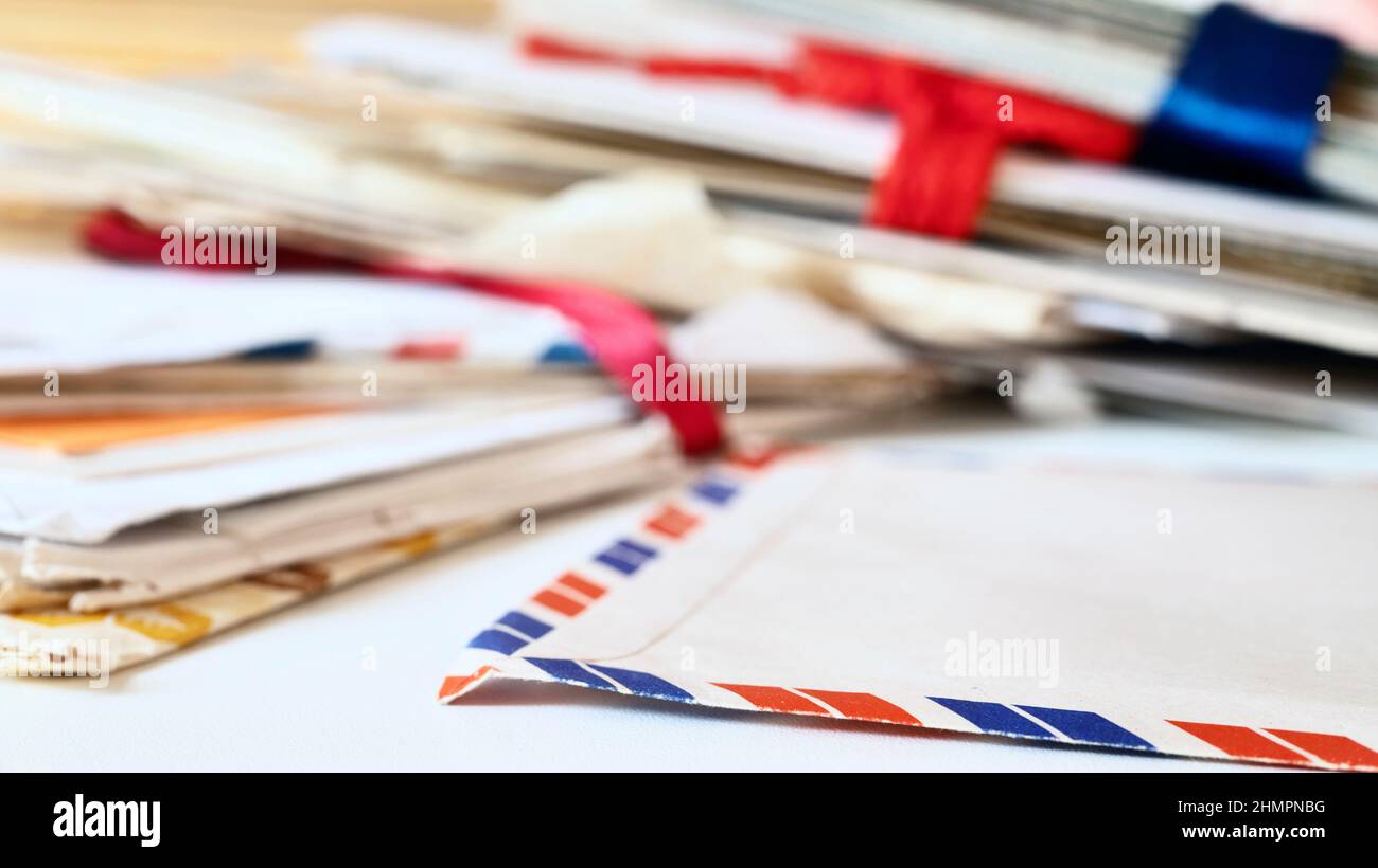 Old letters on table , in the foreground an opened airmail envelope ...
