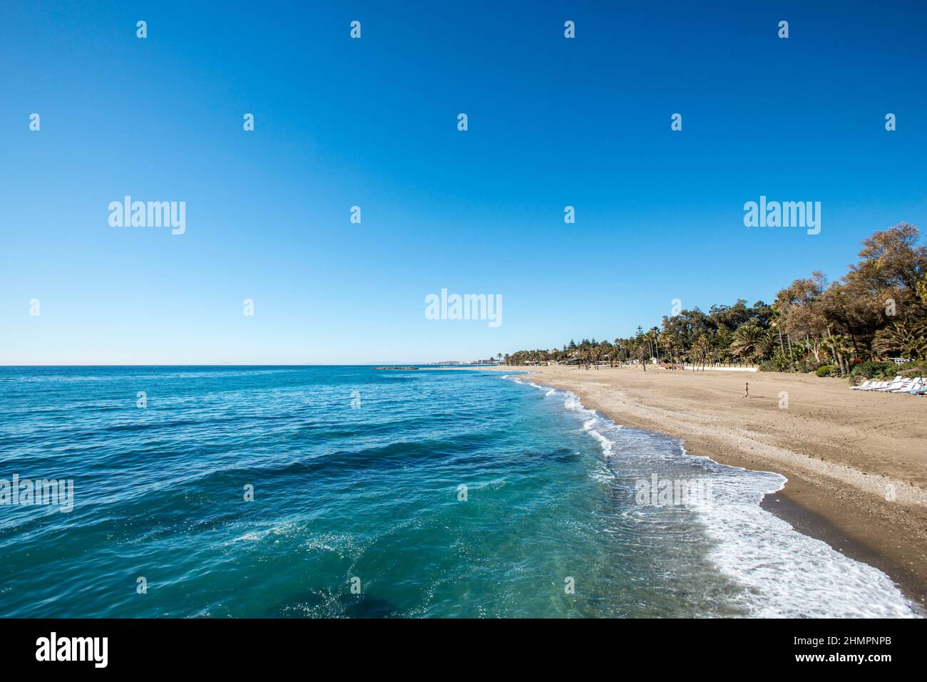 Walk along the beautiful beaches of Marbella Stock Photo - Alamy