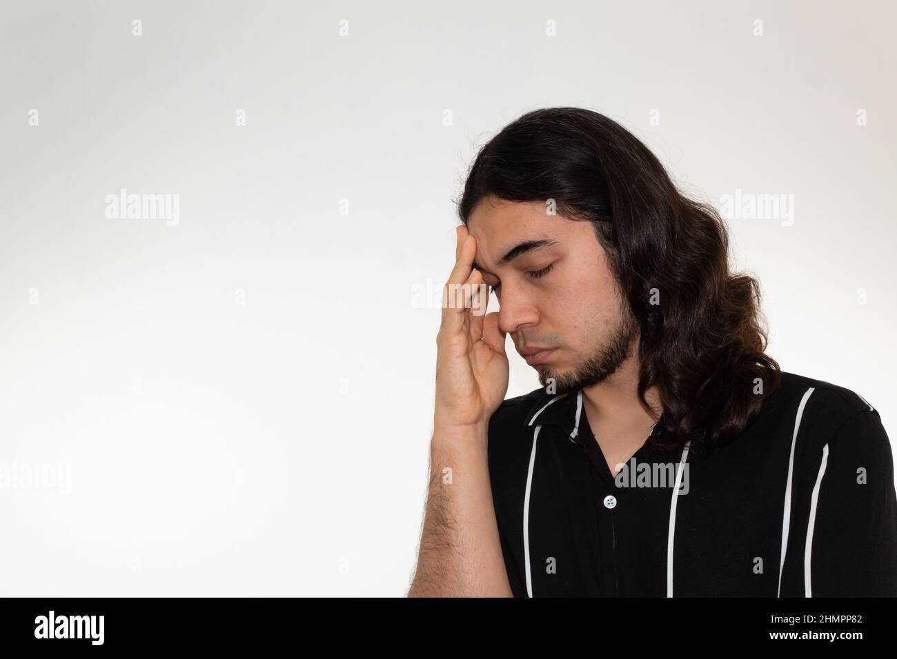 portrait of a hispanic man with a headache, stress and frustration on a ...