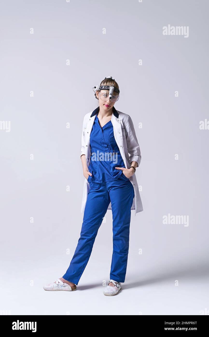 Confident ENT doctor wearing surgical headlight head light and ...