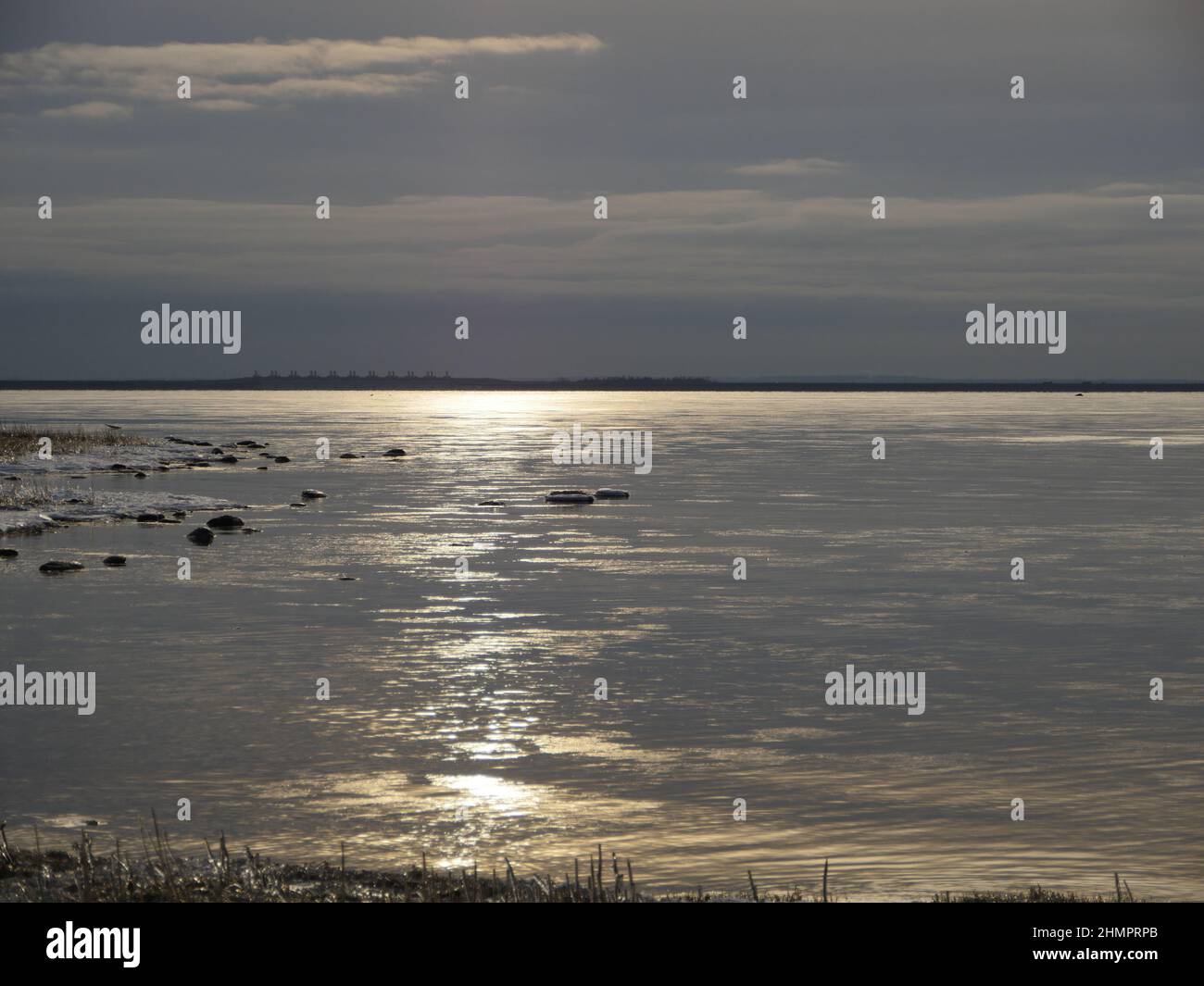 dark cloudscape dramatic seascape, water covered with ice Stock Photo ...