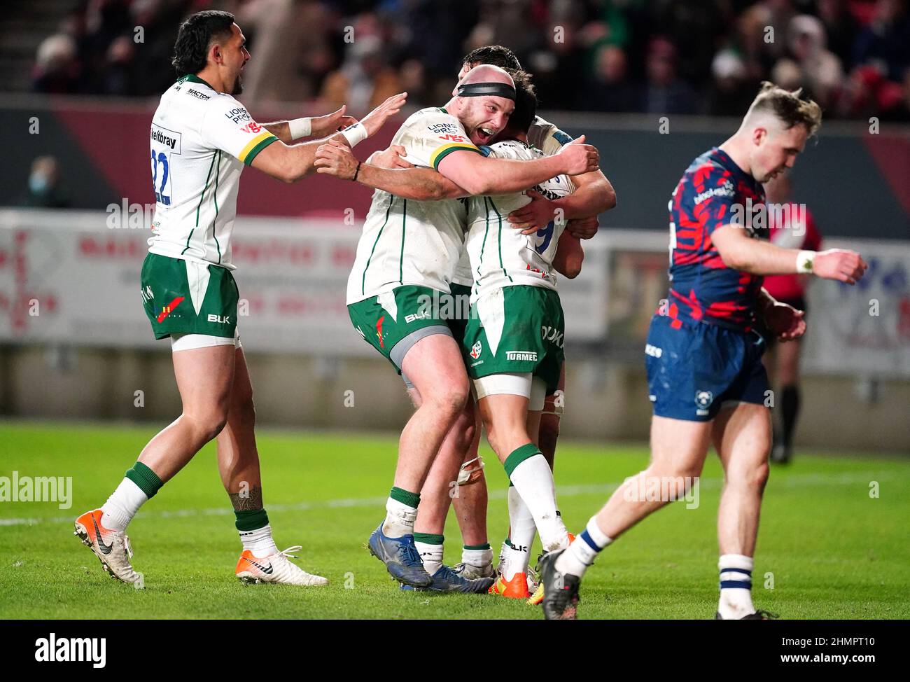 London Irish's Nick Phipps celebrates with team-mates after scoring a ...