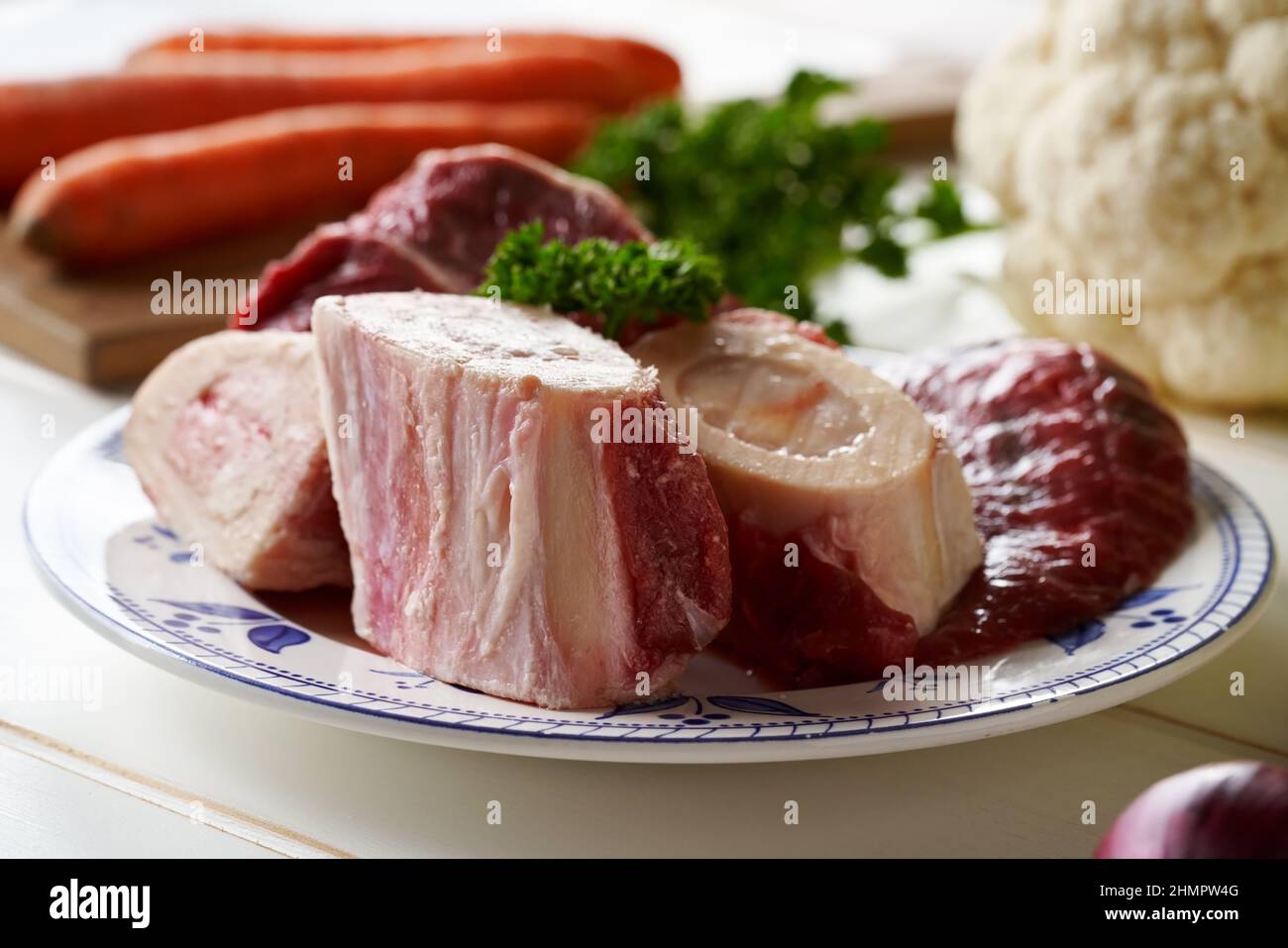 Ingredients for preparing beef broth or soup - fresh marrow bones and ...