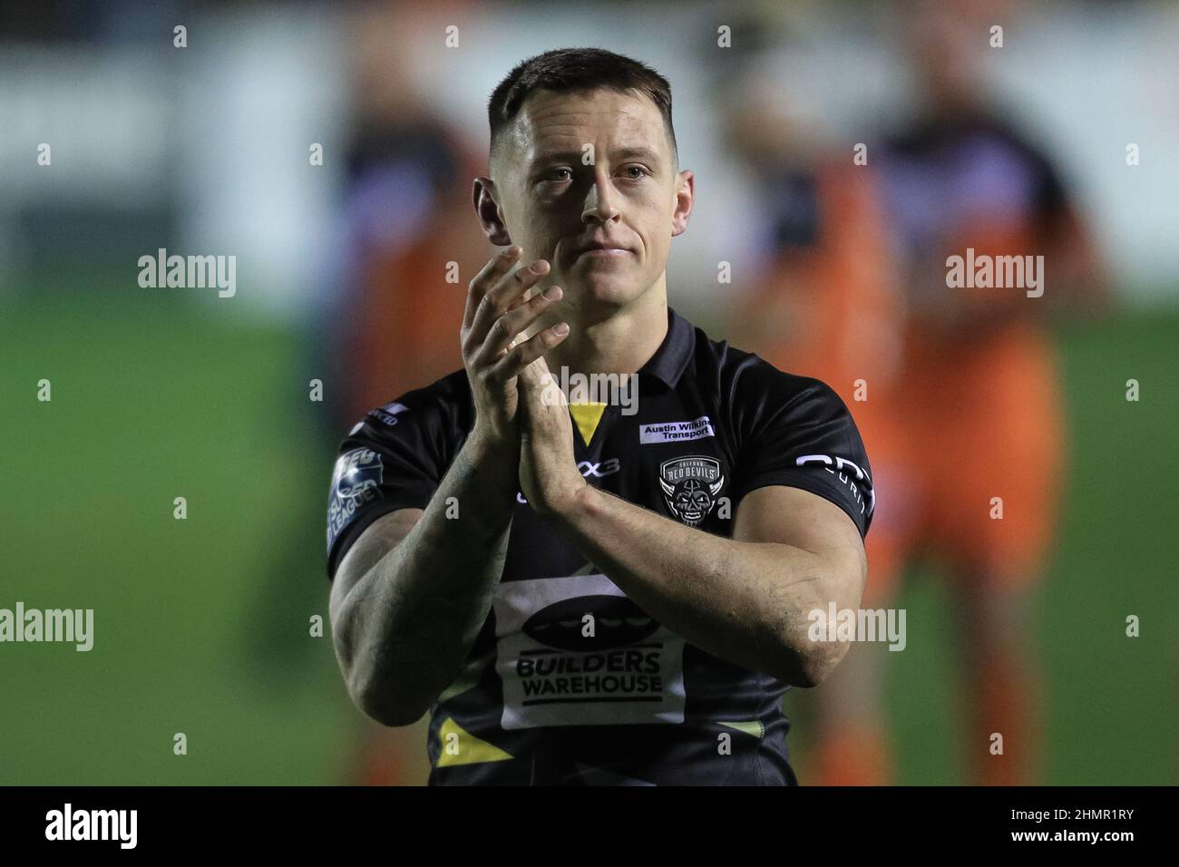 Deon Cross #28 of Salford Red Devils claps his hands and applauds the ...