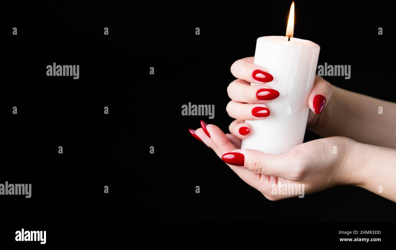 Crop person with burning candle. Crop anonymous person demonstrating ...