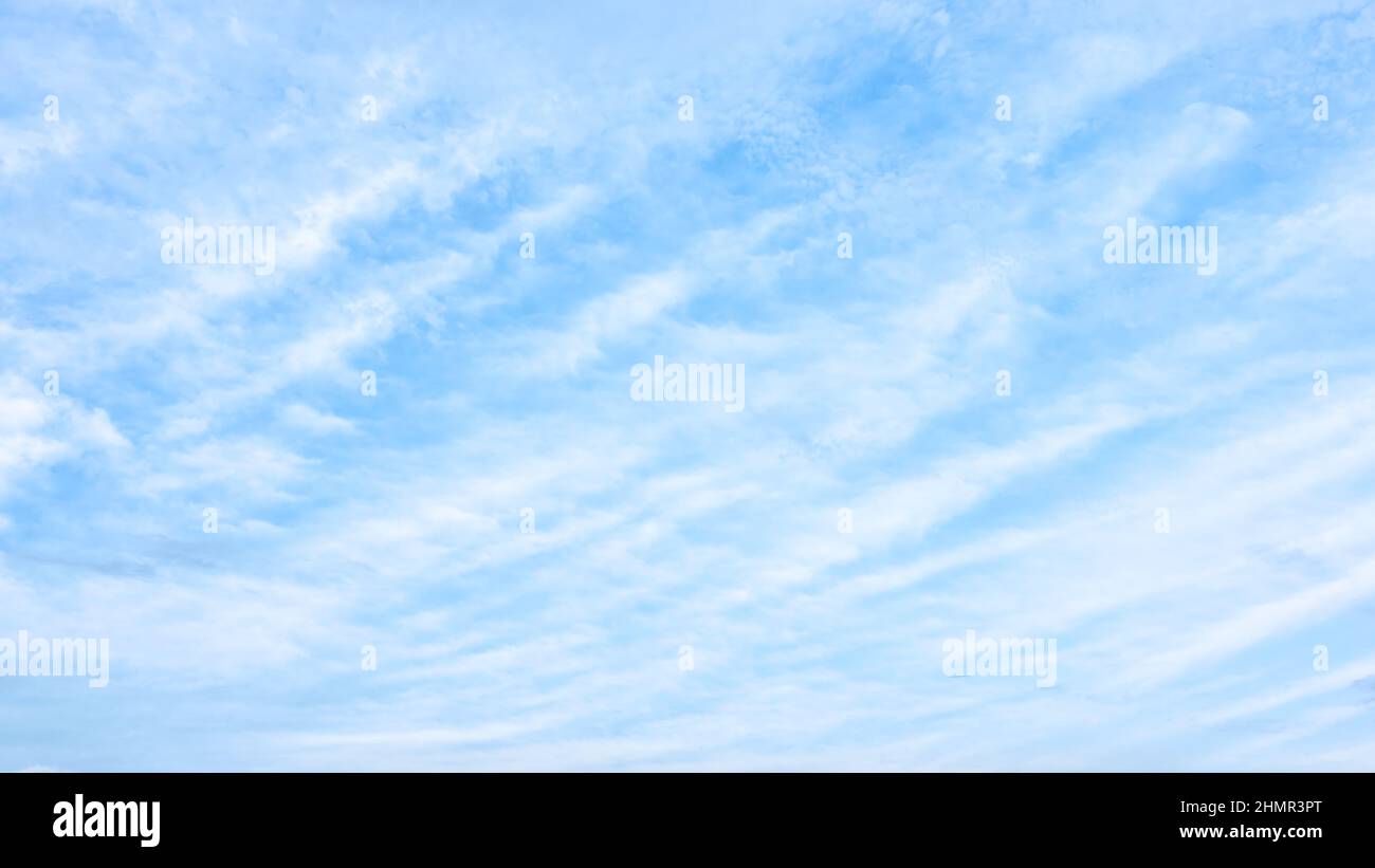 Light-blue sky with white clouds - background Stock Photo - Alamy