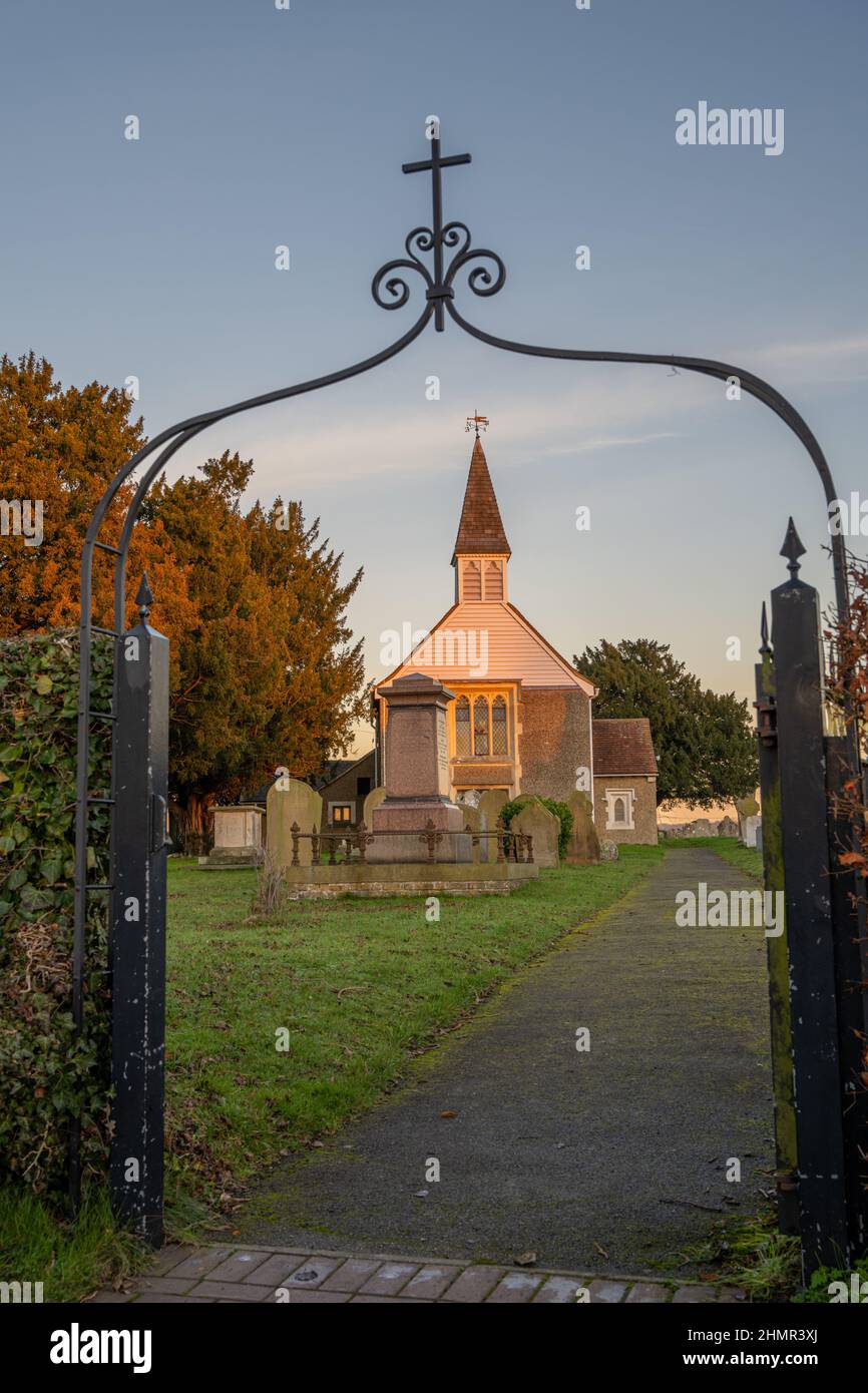 The moon above Saint Margaret's Church Ifield near Gravesend at sunset ...