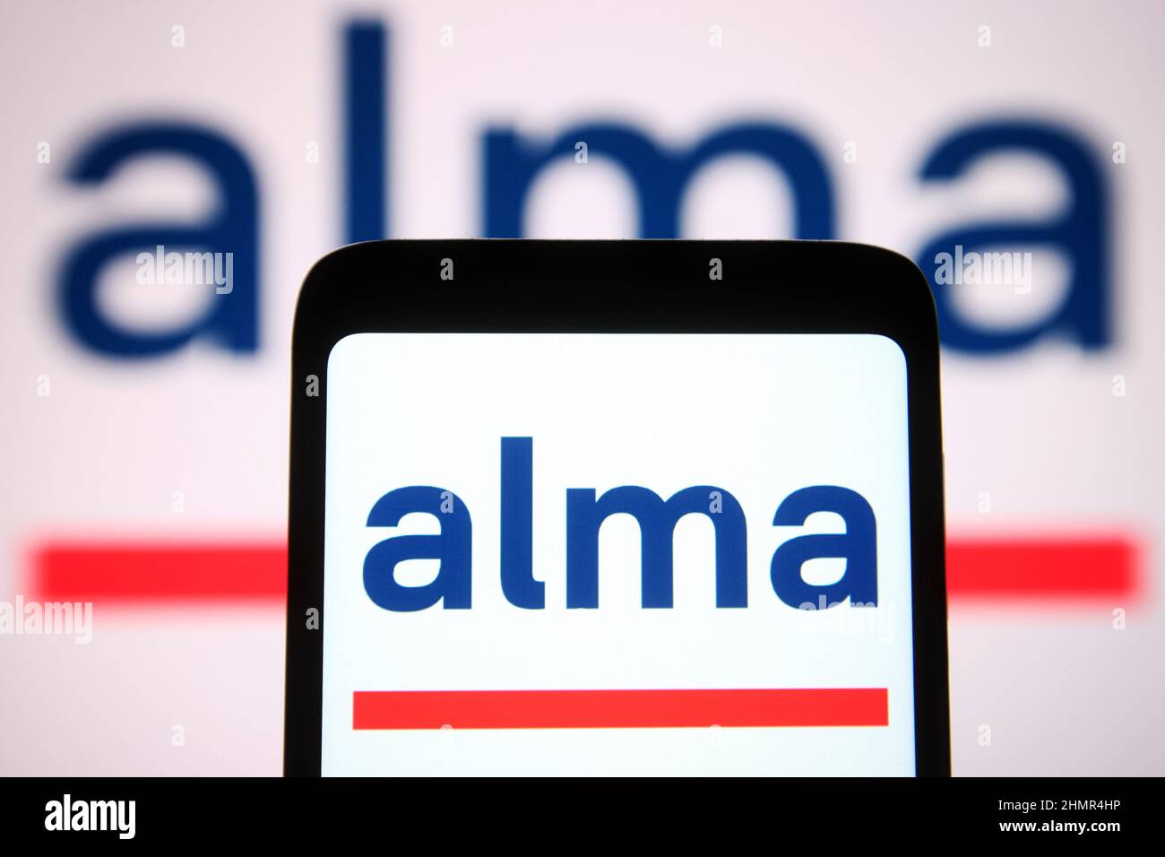 In this photo illustration, an Alma logo is seen on a smartphone screen ...