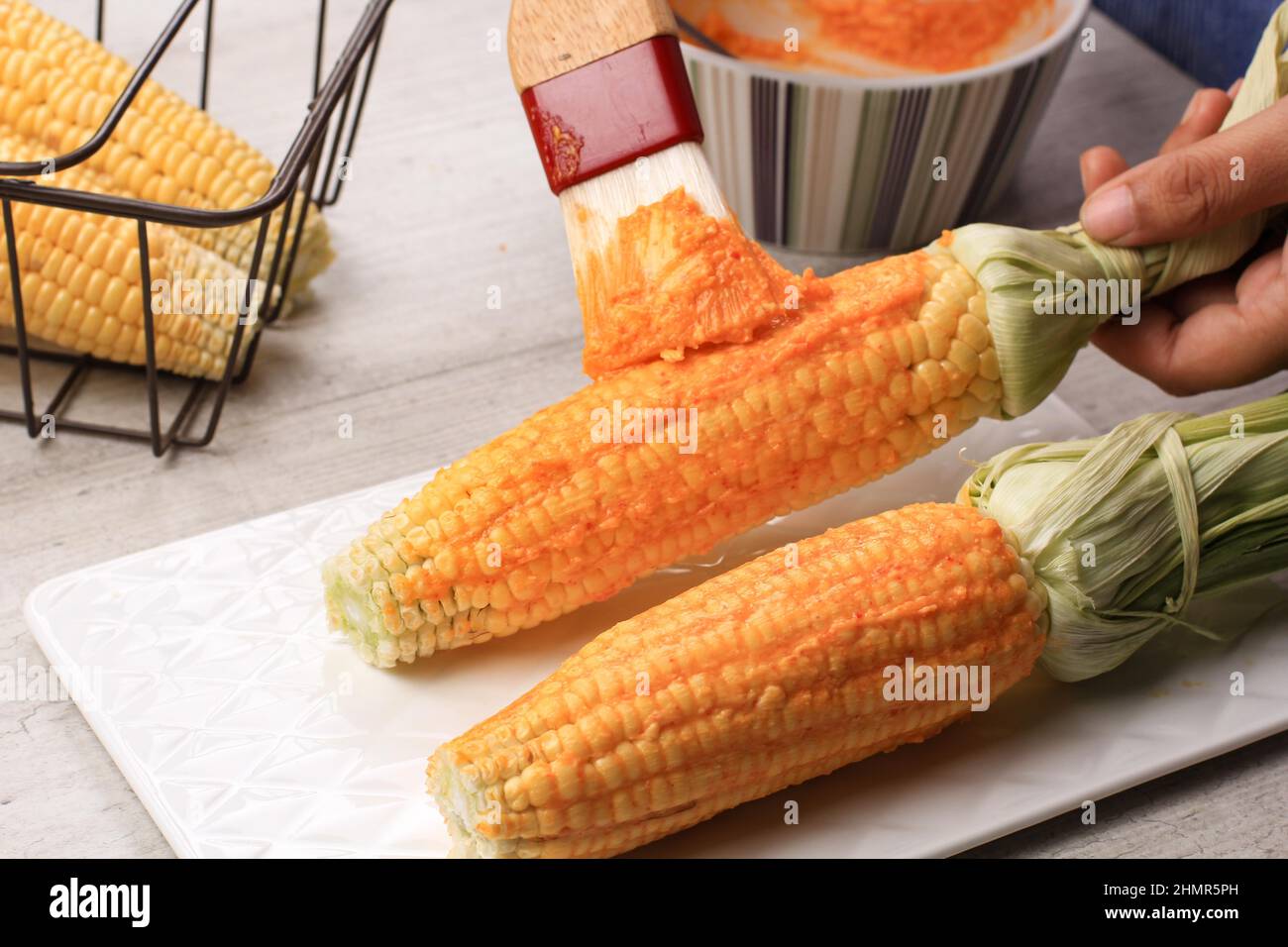 Spreading or Coating Spicy Butter on Sweet Corn, Process Making Roasted ...