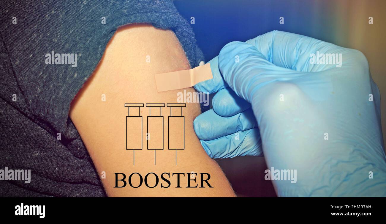 Close up of a person arm after booster third dose vaccination. Doctor ...