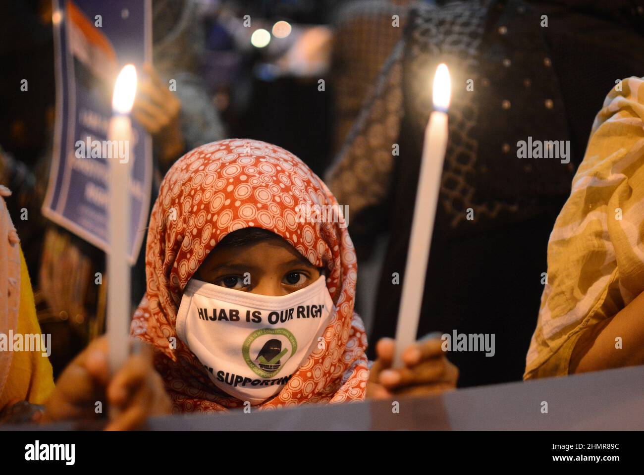 Kolkata, India. 11th Feb, 2022. A woman take to the street and held a candlelight march to ...