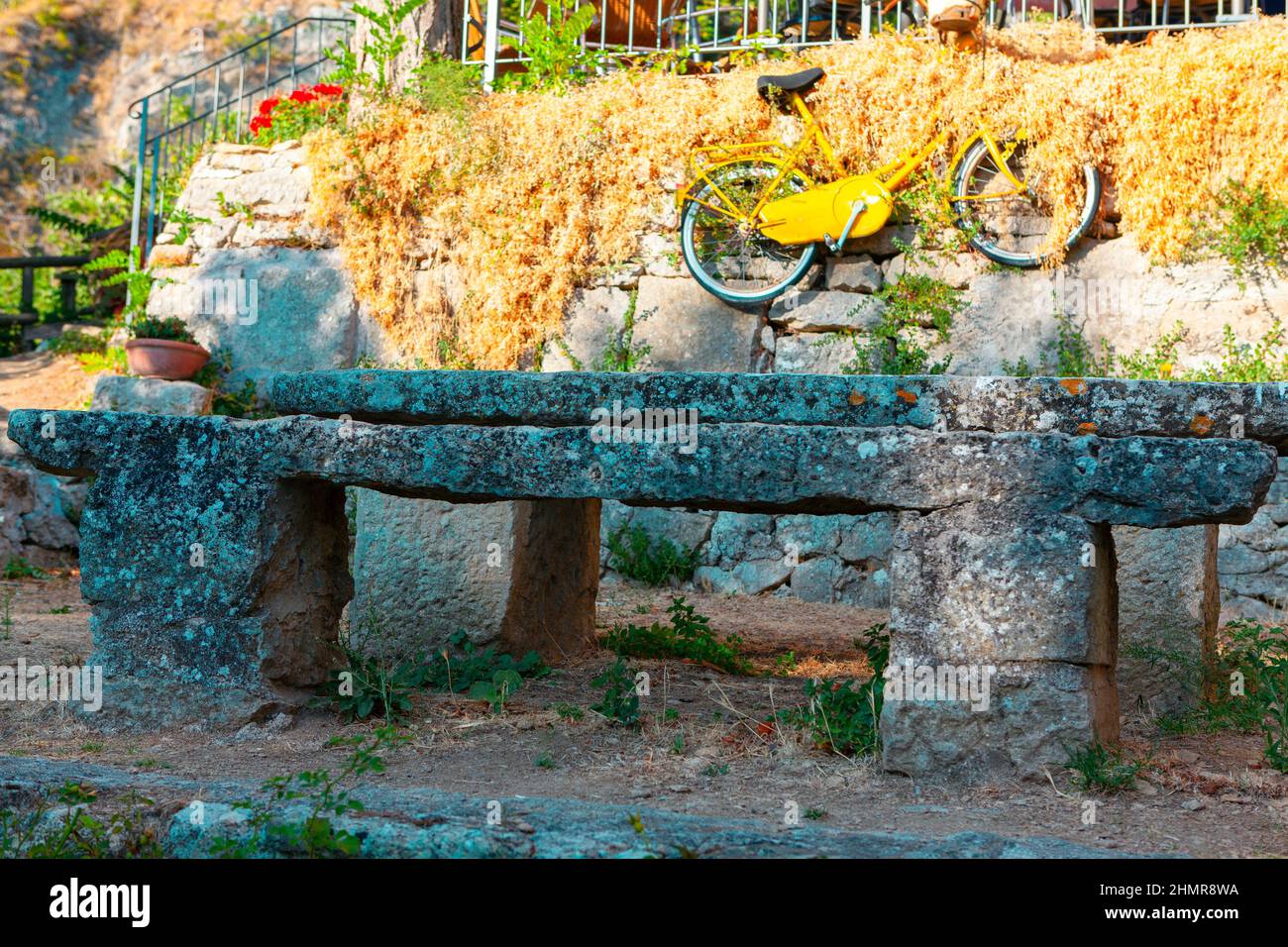 Stone bench in old town . Ancient stone seat . Street bench in San ...