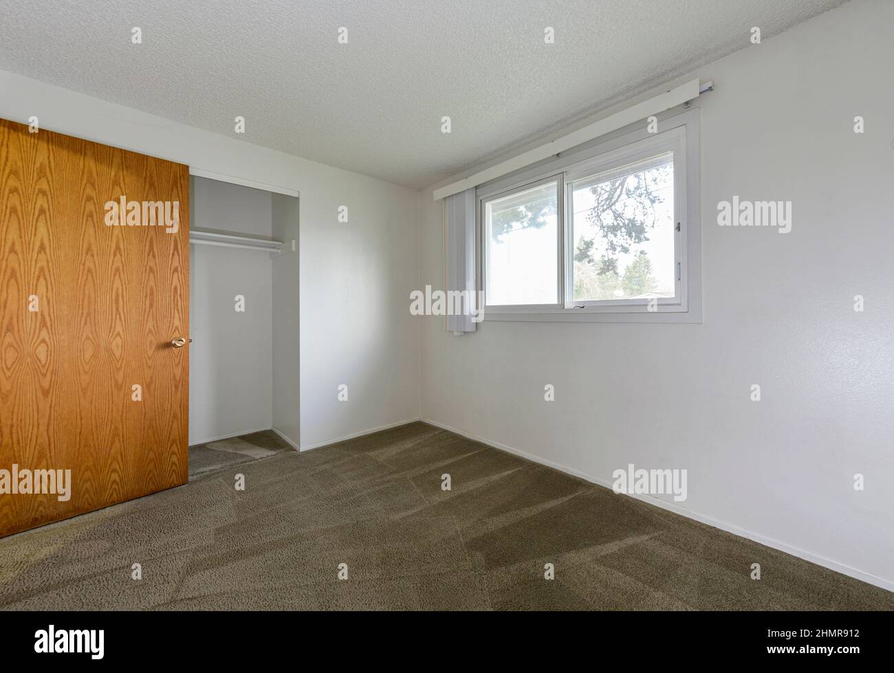 Modern residential empty bedroom interior Stock Photo - Alamy