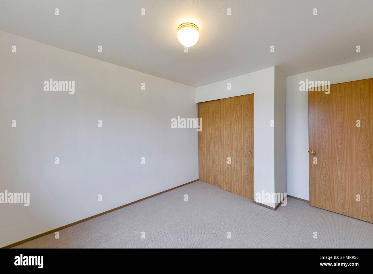 Modern residential empty bedroom interior Stock Photo - Alamy