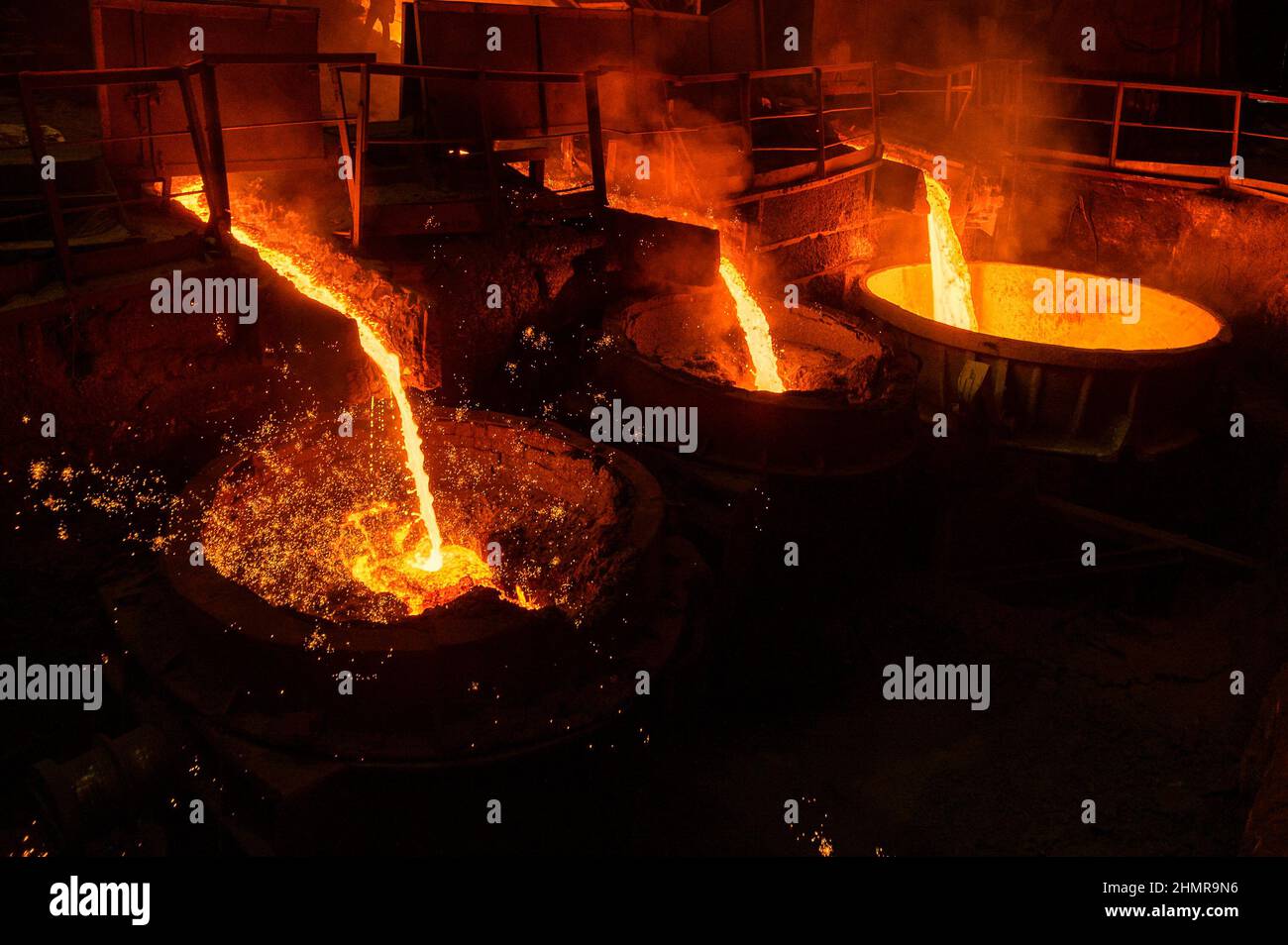 Blast furnace slag tapping. The molten slag is poured into a ladle ...