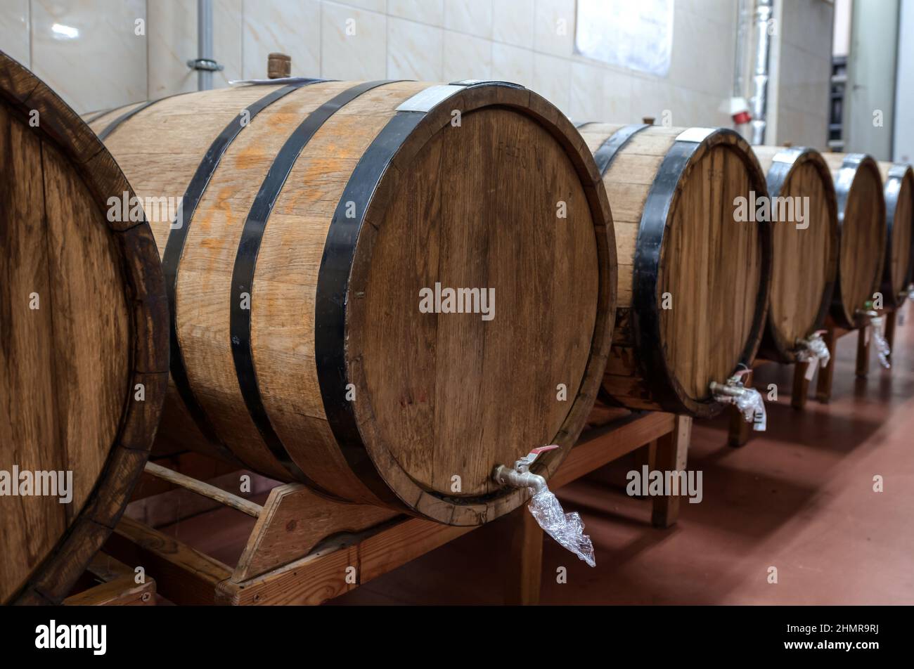 Wooden cask to make luxury alcohol drinks stand in cellar Stock Photo ...