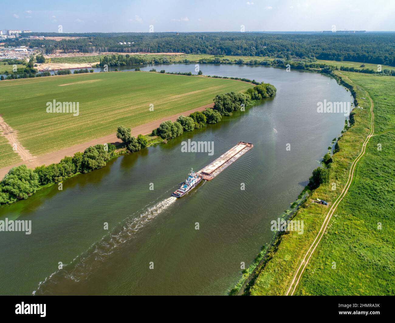 A cargo barge floats on the river Stock Photo - Alamy