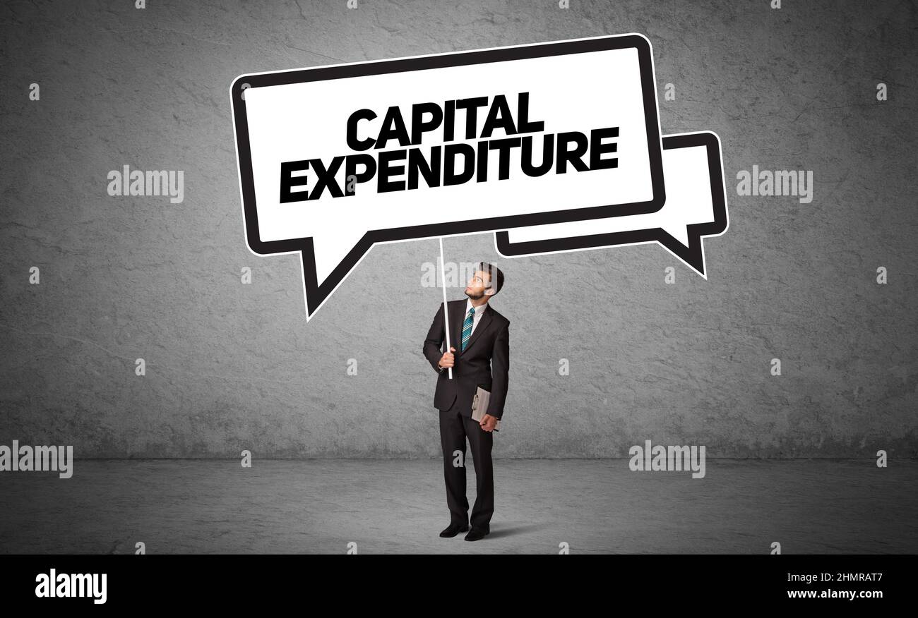 business person in casual holding road sign Stock Photo - Alamy