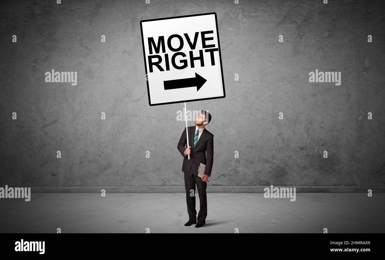 business person holding a traffic sign Stock Photo - Alamy