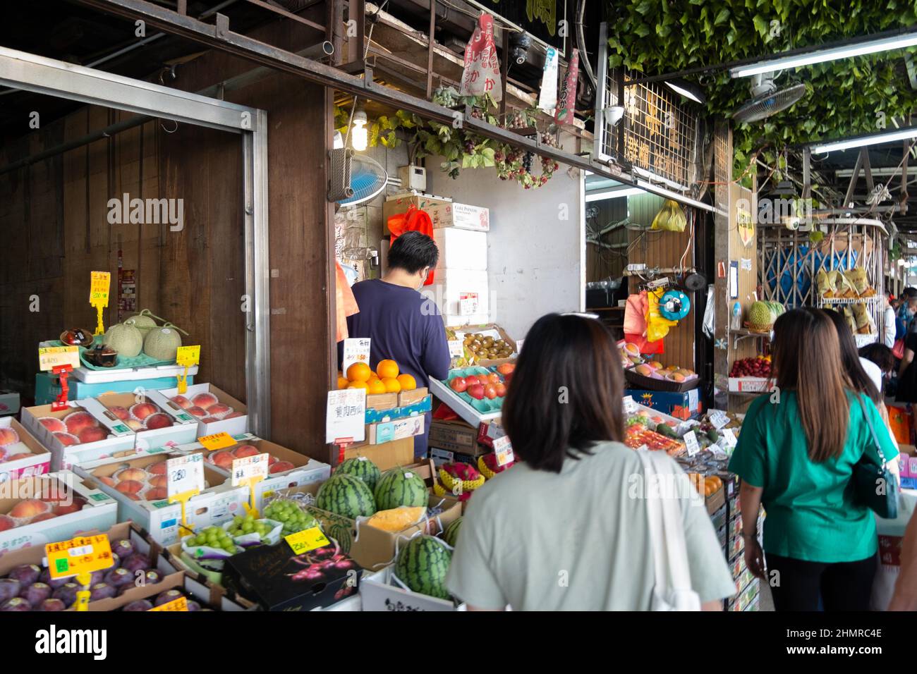 People buying and selling fruits at Yau Ma Tei Fruit Market in Hong ...