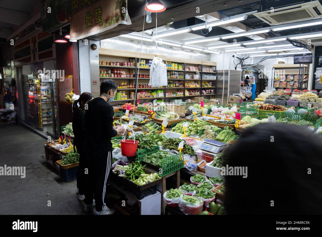 Store selling vegetables, fruits and other goods in the night during ...
