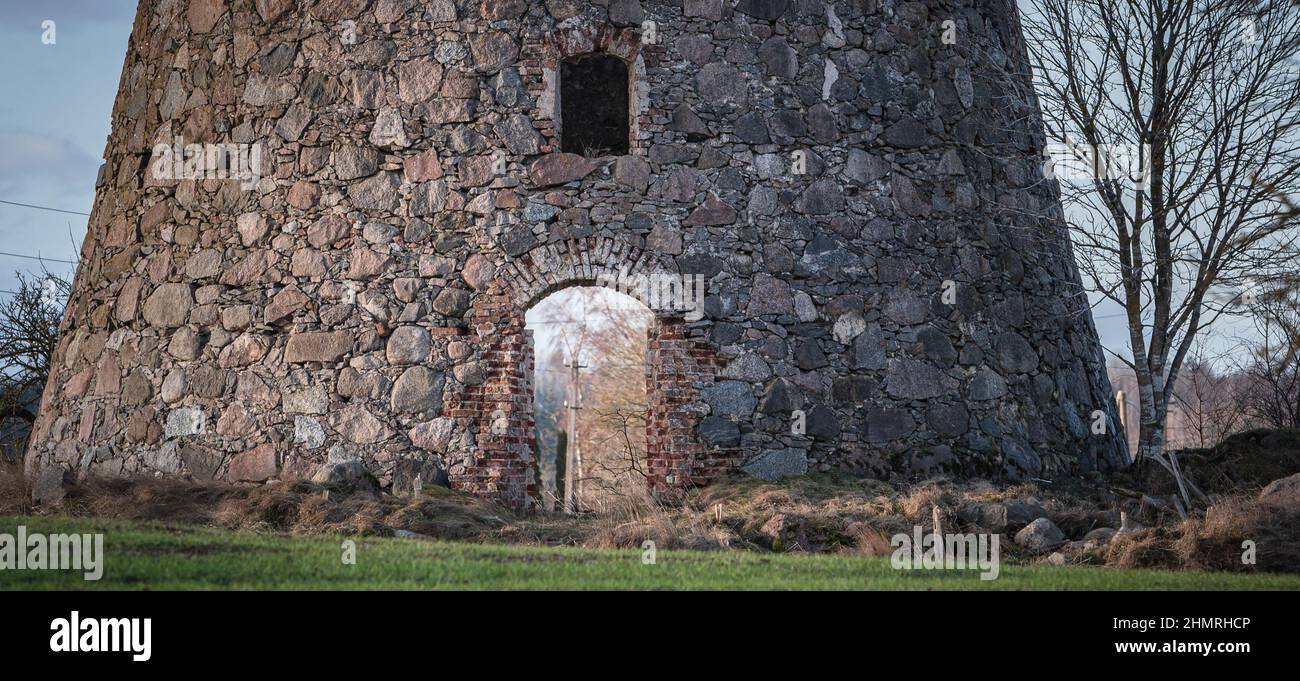 abandoned mill stone masonry building without a door, you can see the ...
