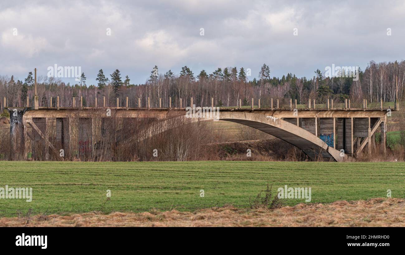 abandoned unfinished bridge over the river arched which was intended ...