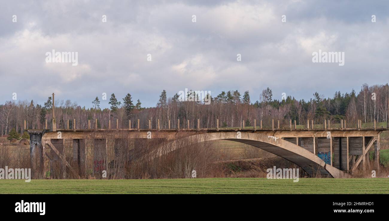 abandoned unfinished bridge over the river arched which was intended ...