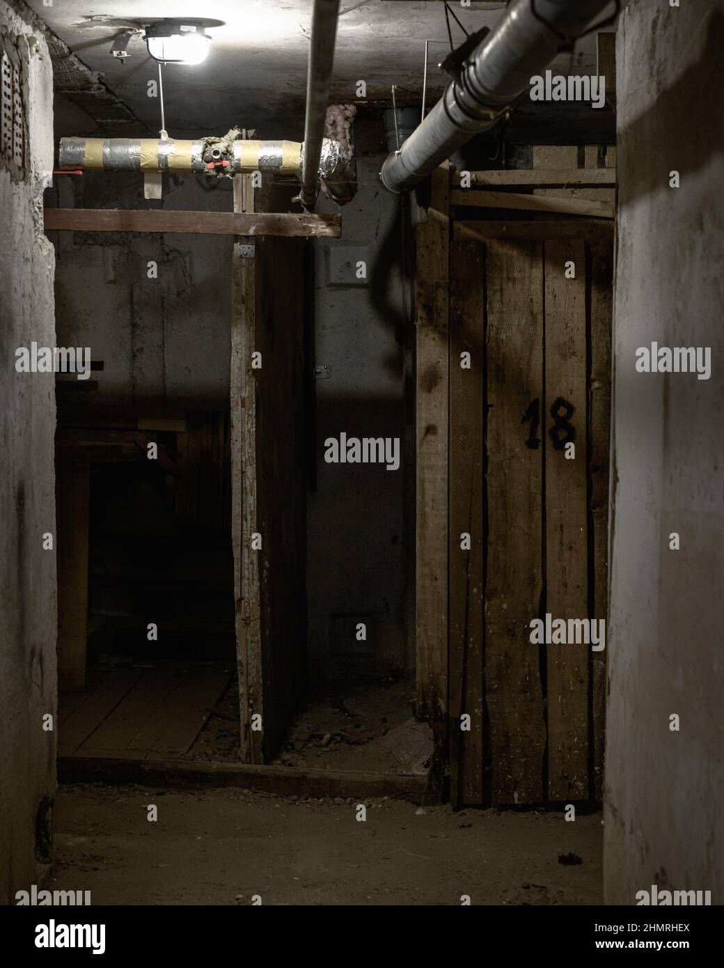 abandoned basement with electricity and sewers in the basement of a ...