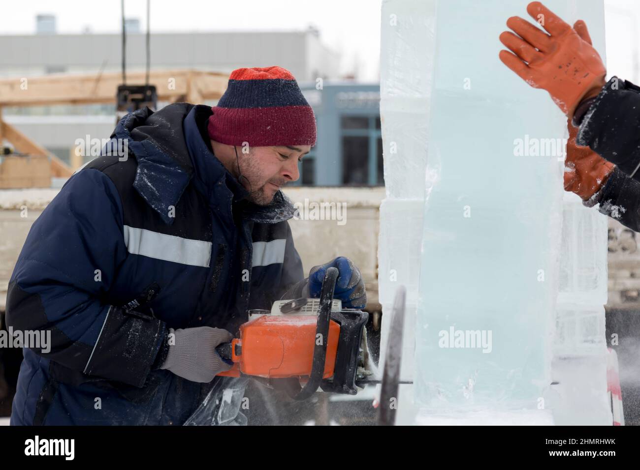 Workman assembler customize chainsaw ice plate Stock Photo - Alamy