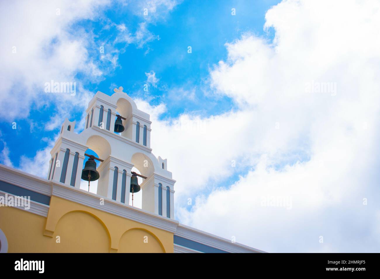 Low angle shot of the Three Bells of Fira, Greek Catholic church in ...