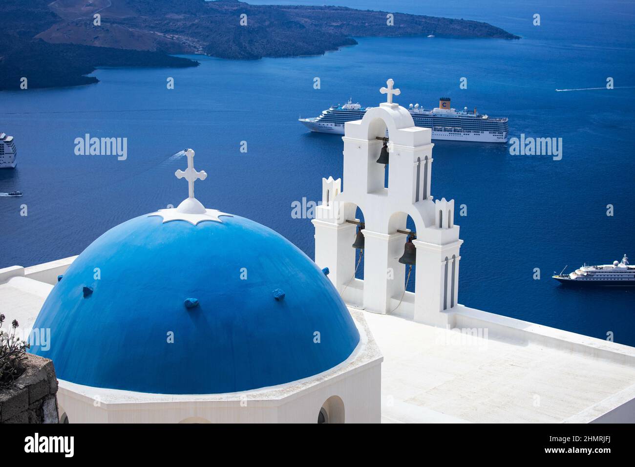 View of the Three Bells of Fira, Greek Catholic church in Fira ...