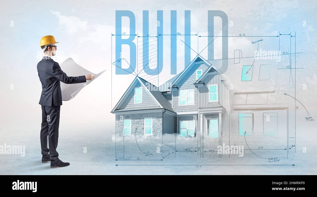 Young engineer holding blueprint Stock Photo - Alamy