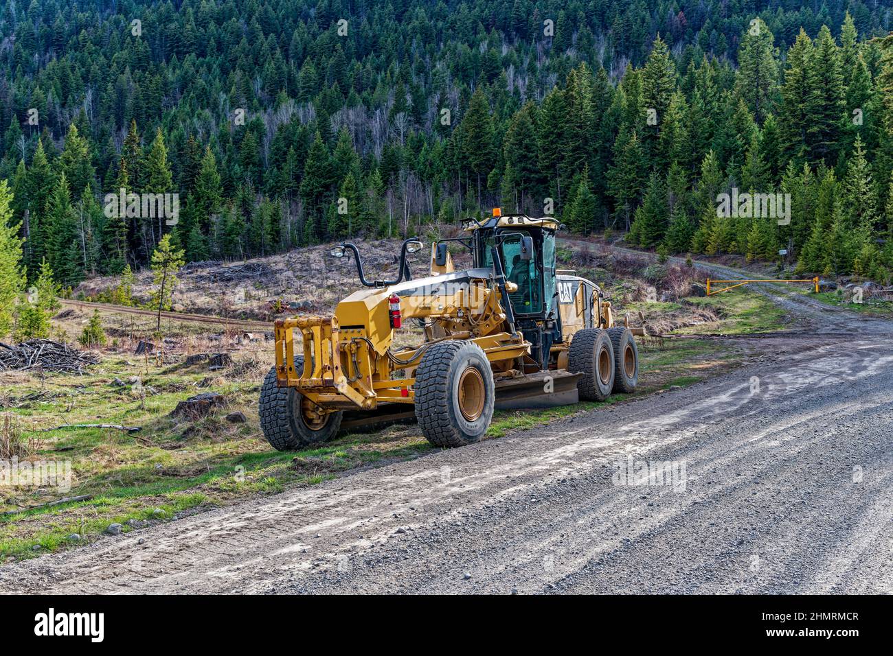 A Caterpillar 14M Motor Grader parked near Pass Lake in British ...